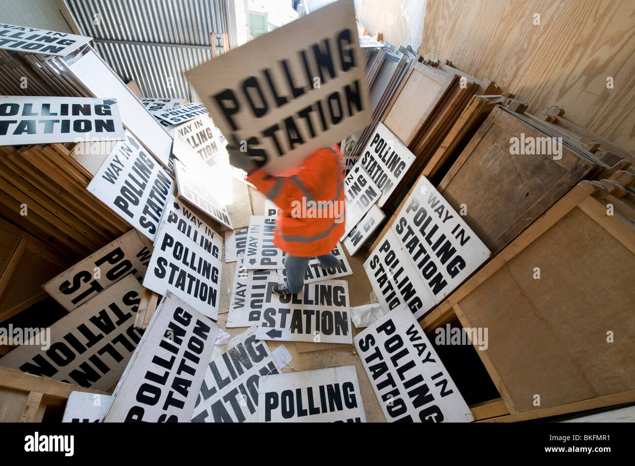 A council official sorts through 100's of polling signs and booths in ...