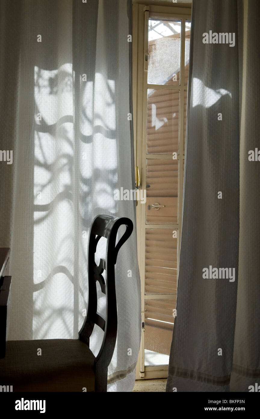 Window light forming an abstract pattern from light through curtain ...