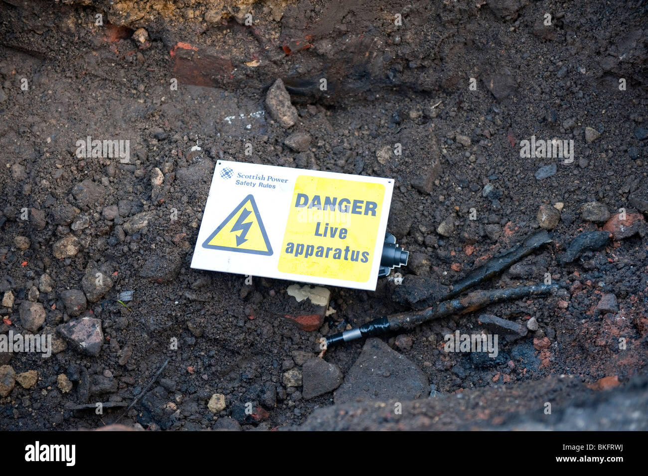 Danger Live Apparatus underground electric cable Stock Photo - Alamy