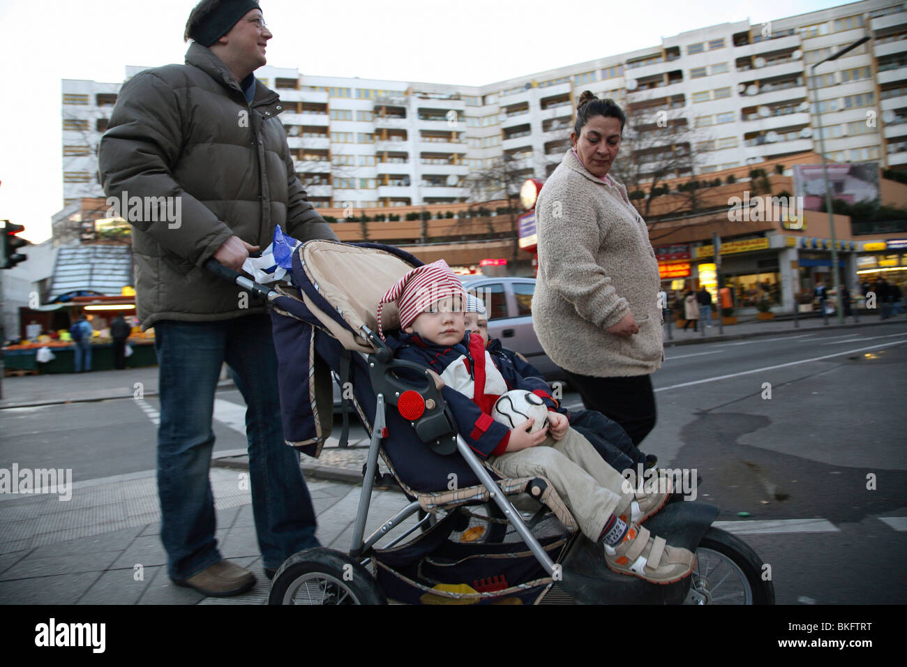 Father pushing a pram, Berlin, Germany Stock Photo - Alamy