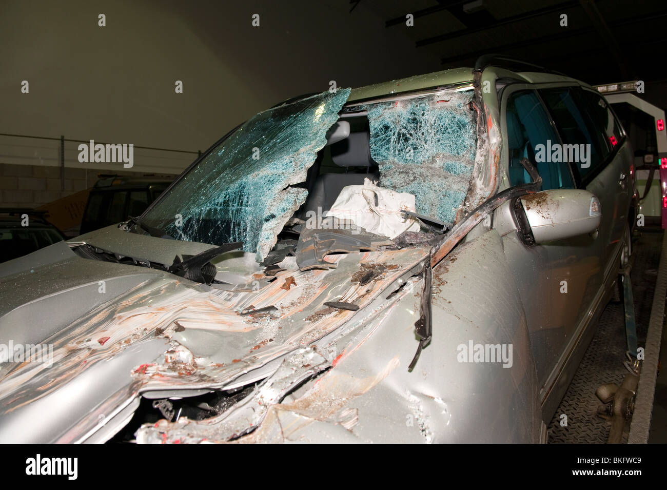 Car crushed after running under back of HGV lorry Stock Photo - Alamy