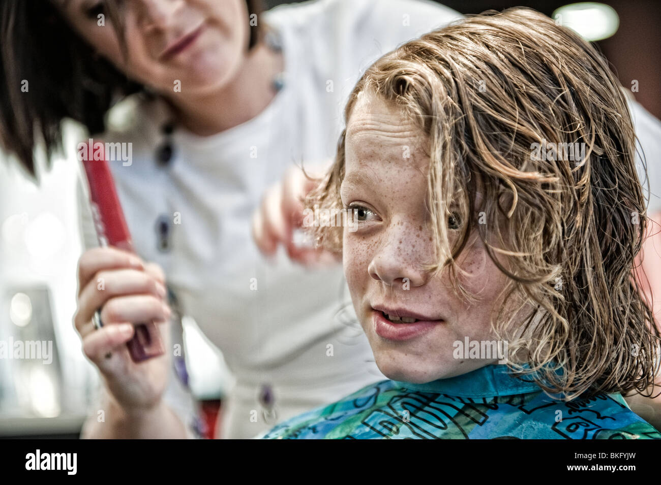 Little boy getting his hair cut Stock Photo - Alamy