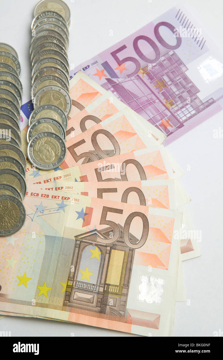 money euros coin bills dolars vertical Stock Photo - Alamy