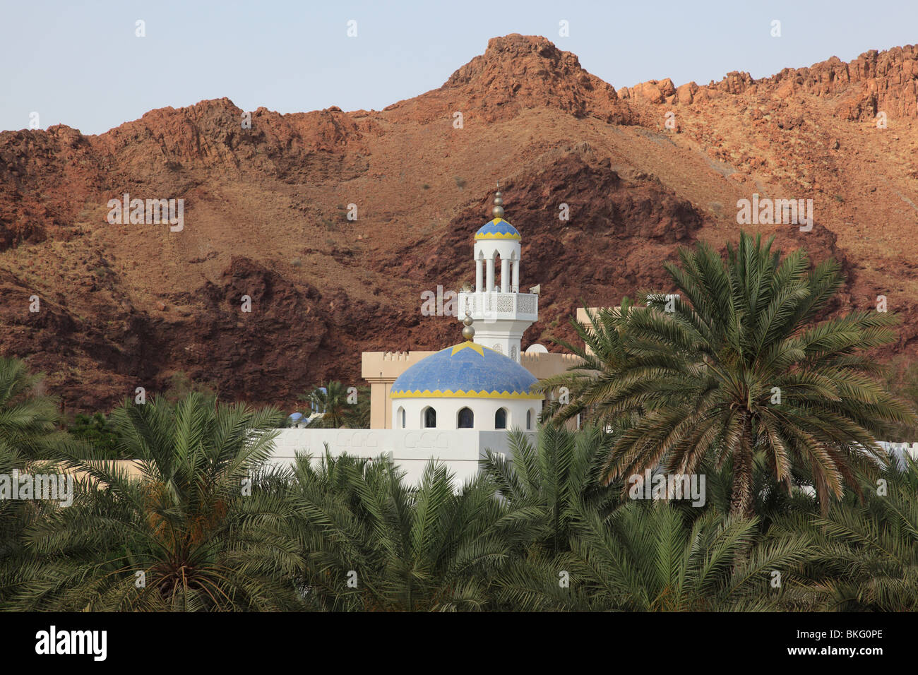 Minaret and mosque in wadi with date palms at the village of Fanja ...