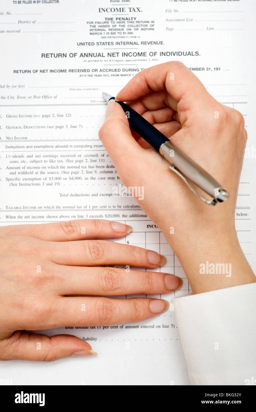 filling a tax form for american IRS Stock Photo - Alamy