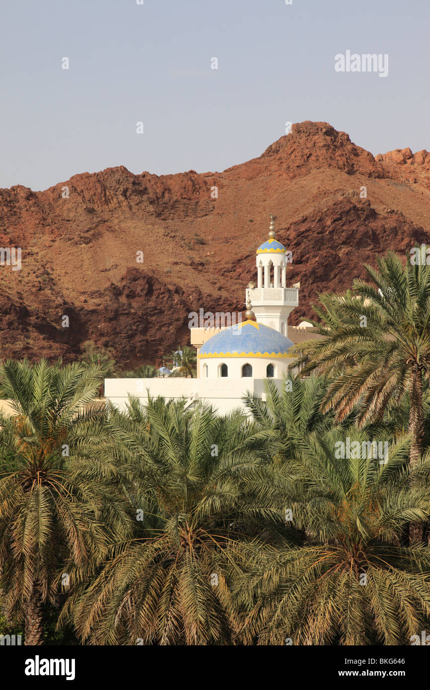 Minaret and mosque in wadi with date palms at the village of Fanja ...