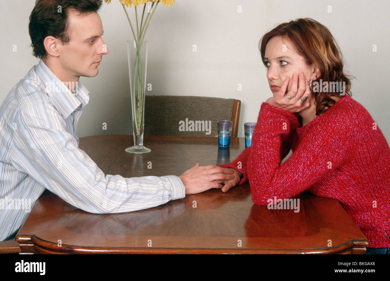 Sad adult couple sit table hi-res stock photography and images - Alamy