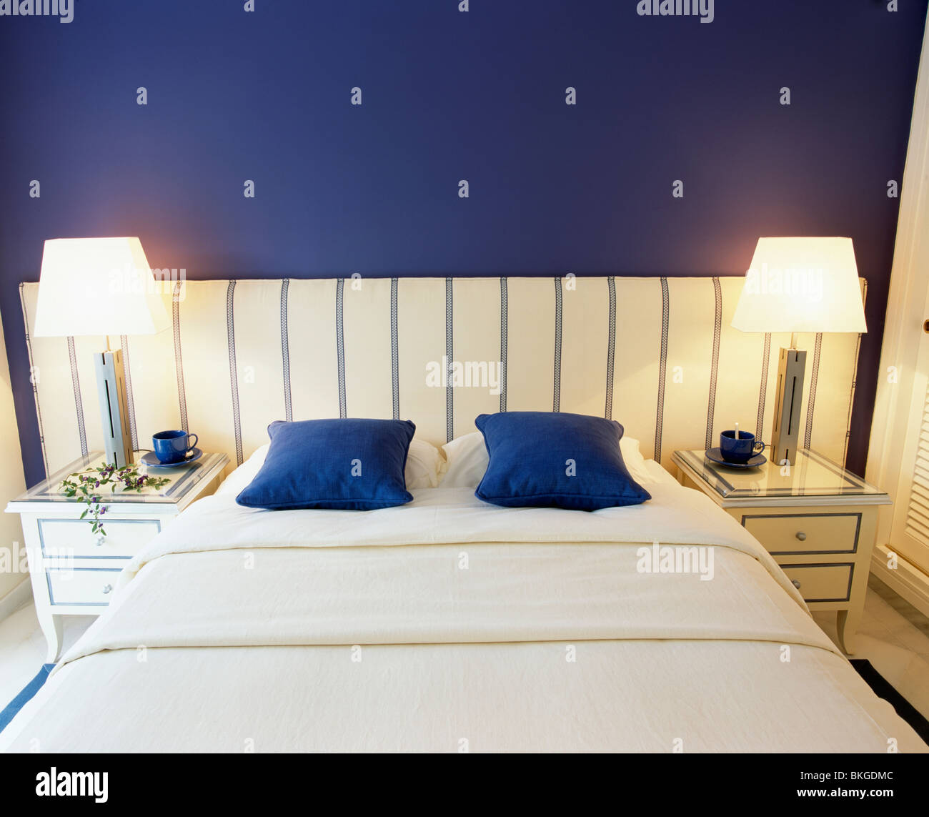 Bright blue cushions on bed hi-res stock photography and images - Alamy