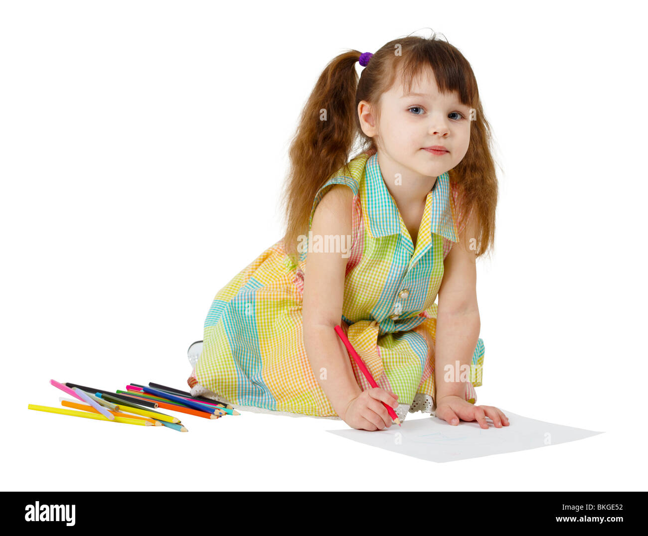 Child draws with colored pencils on the floor Stock Photo - Alamy