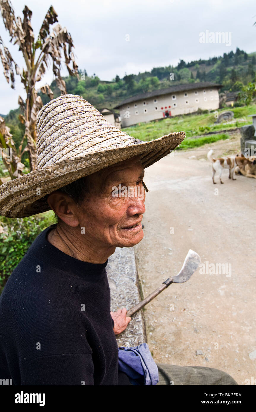 A Hakka man resting in his village Stock Photo - Alamy