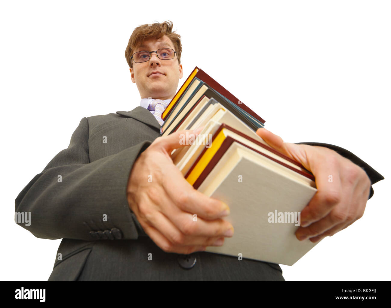 A young man with a pile of books in the hands Stock Photo - Alamy