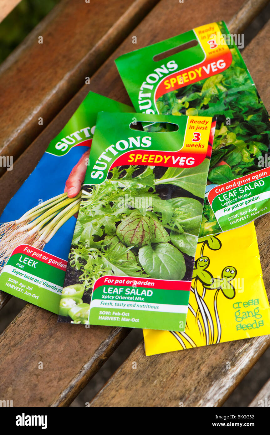 Packets of vegetable seeds scattered on a wooden table Stock Photo - Alamy