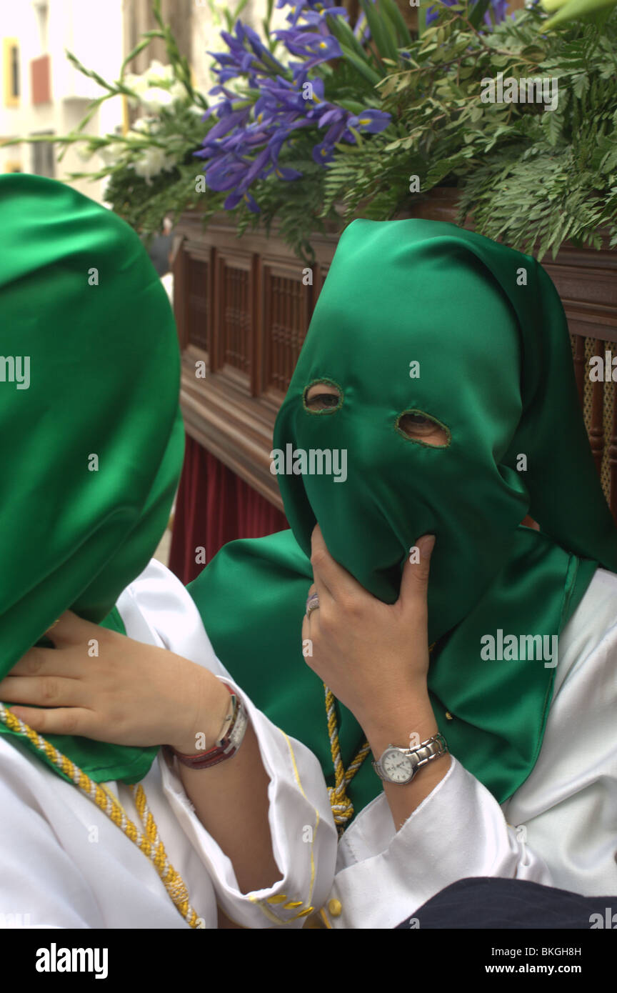 Women covered by hoods during holy week procession Stock Photo - Alamy