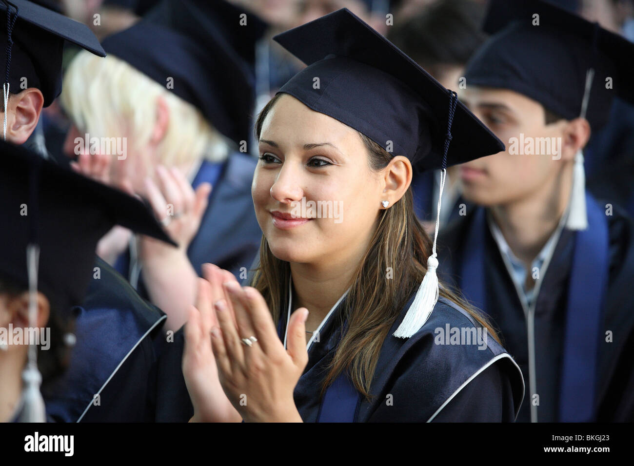 Female student applauding during a graduation ceremony, Jacobs ...
