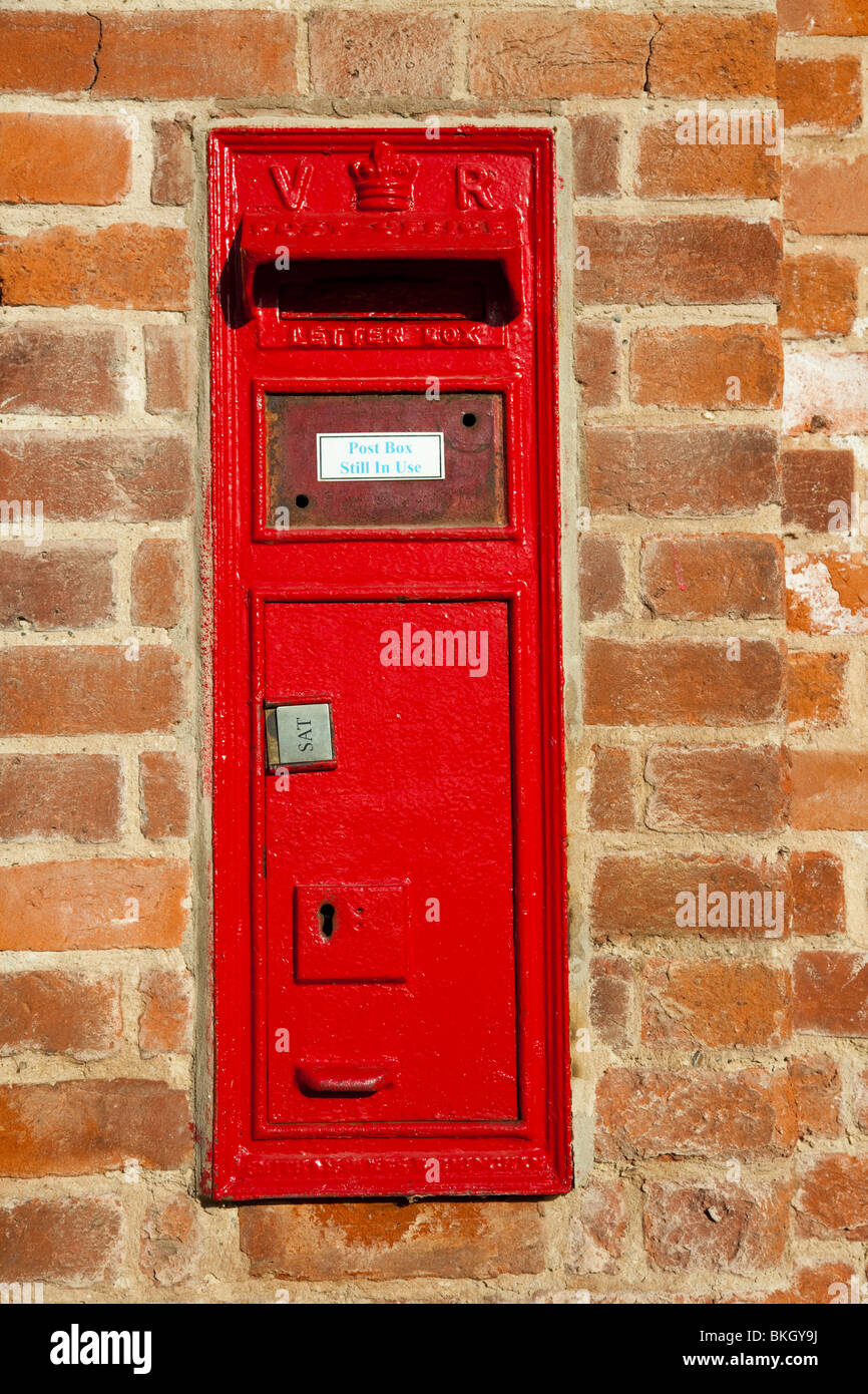 Victorian post box in a wall at Snape Maltings, Suffolk, UK Stock Photo ...