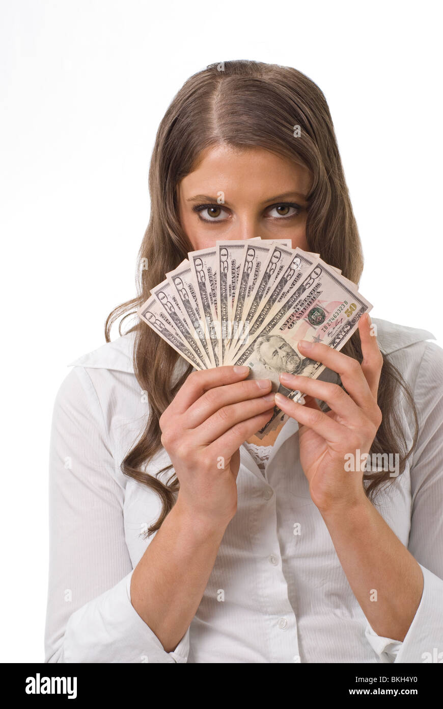 Young woman holding cash Stock Photo - Alamy