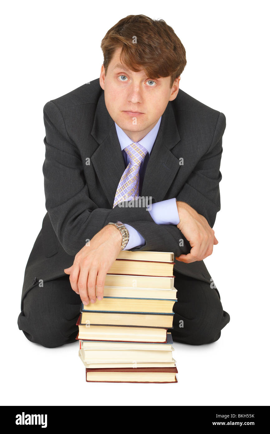 Young erudition man with a stack of books isolated on a white ...