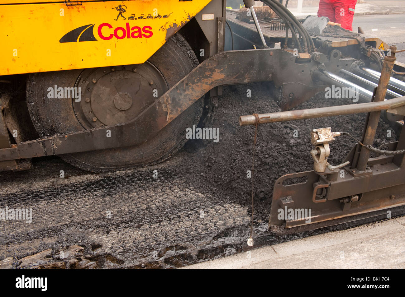 Tarmac being laid on road for resurfacing Stock Photo - Alamy