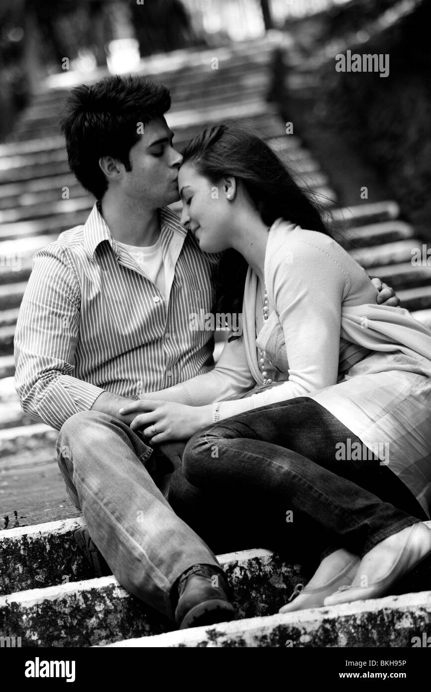 couple in love sitting on steps Stock Photo - Alamy