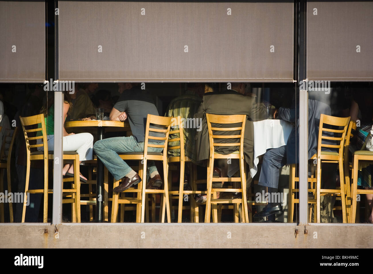 People sitting in a bar seen from outside, Santa Monica, California ...