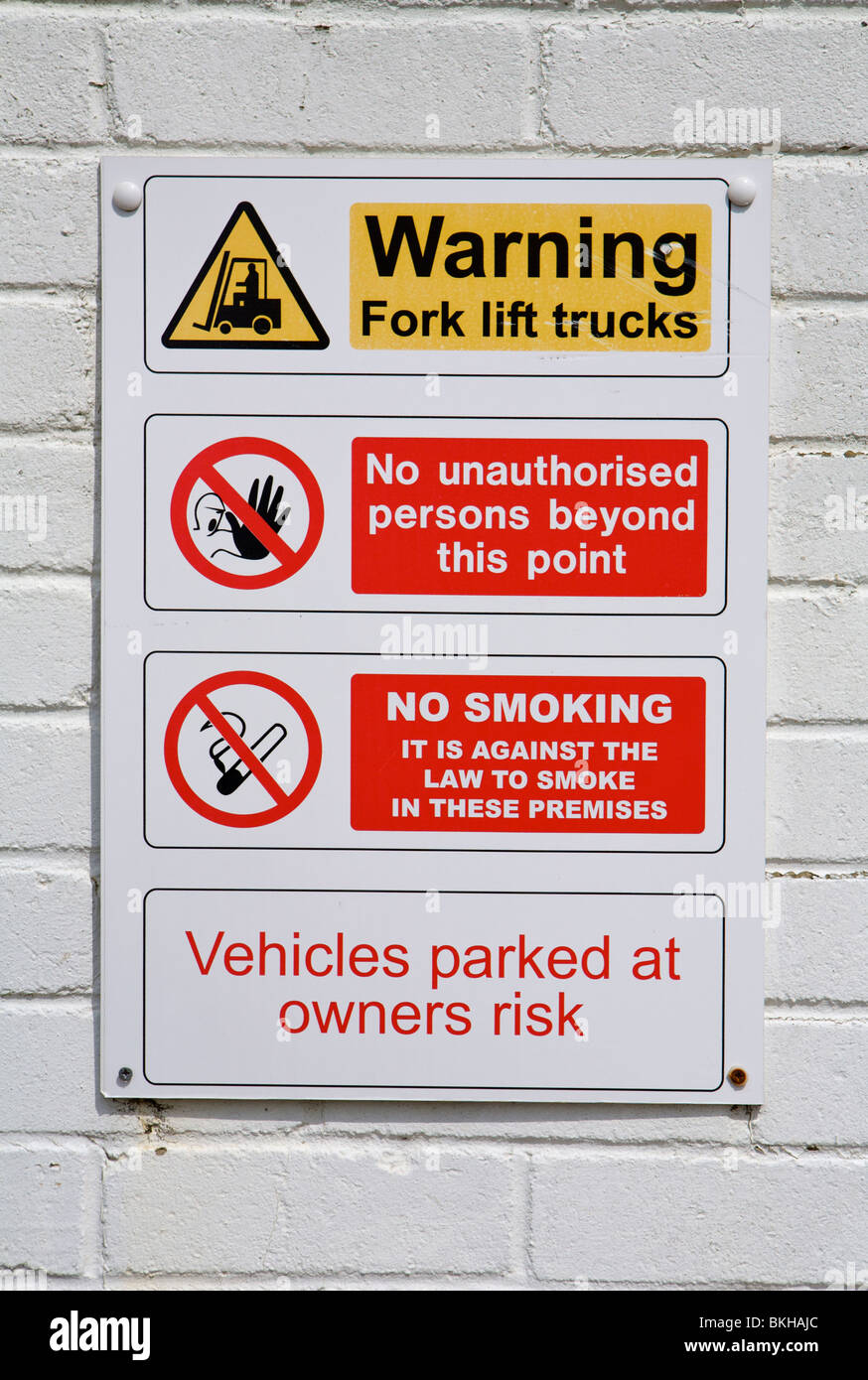Safety warning signs outside industrial facility Stock Photo - Alamy