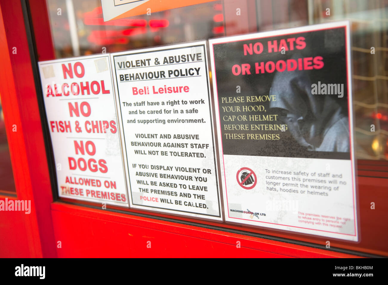 Seaside games arcade warning signs Stock Photo - Alamy