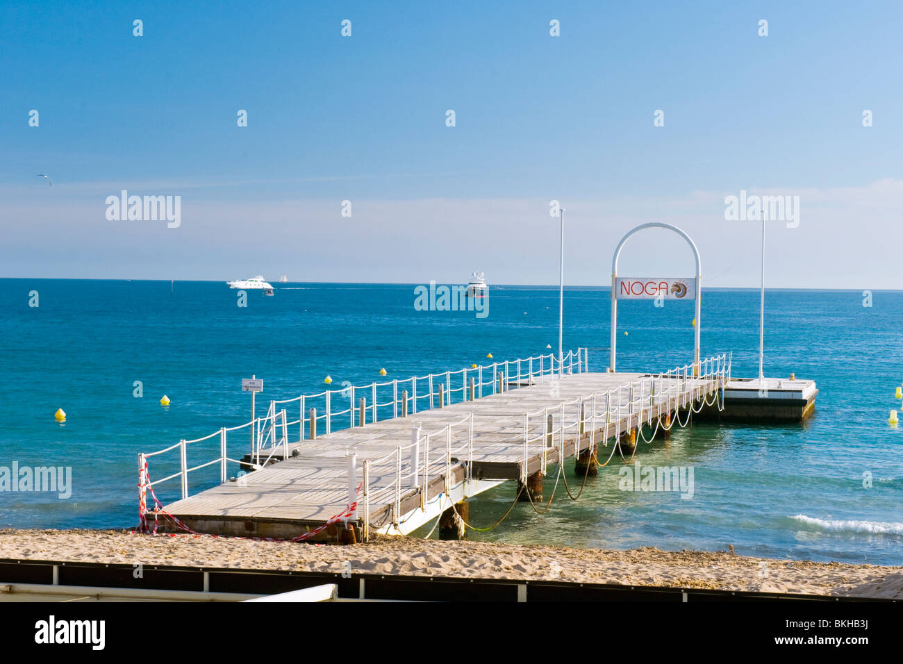 Cannes , La Croisette , view of the Noga Beach & jetty or pier yellow ...