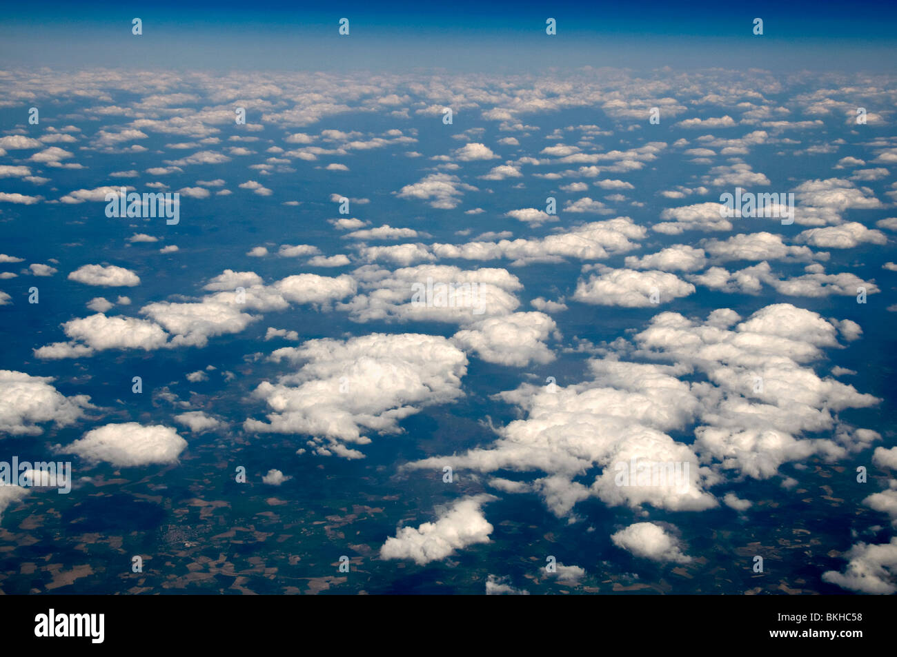 the sky and earth from above taken from an airplane window Stock Photo ...