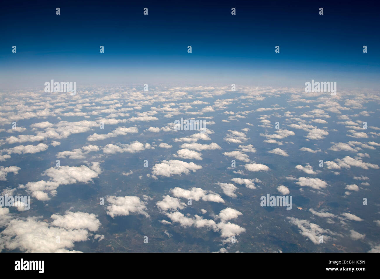 the sky and earth from above taken from an airplane window Stock Photo ...
