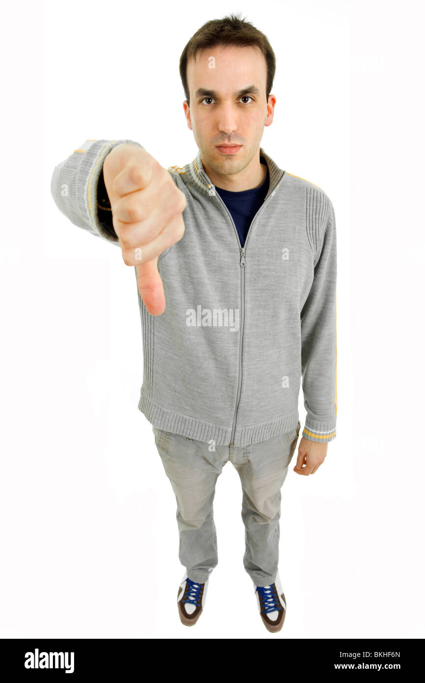 young casual man going thumb down in a white background Stock Photo - Alamy