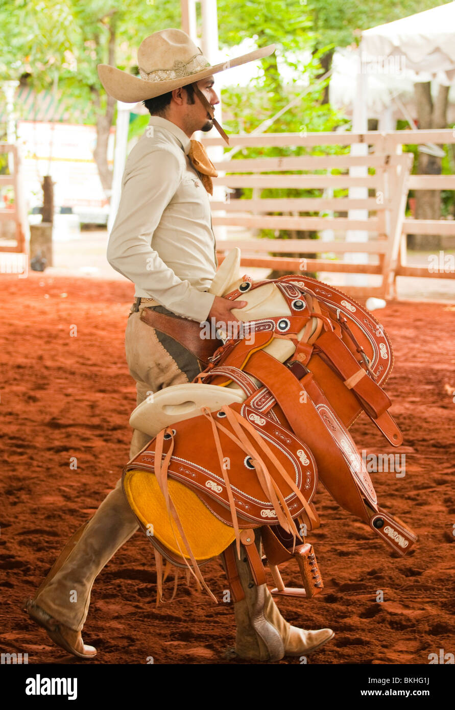 Guadalajara, Mexico, Charro ( Mexican Cowboy) carrying his saddle in ...