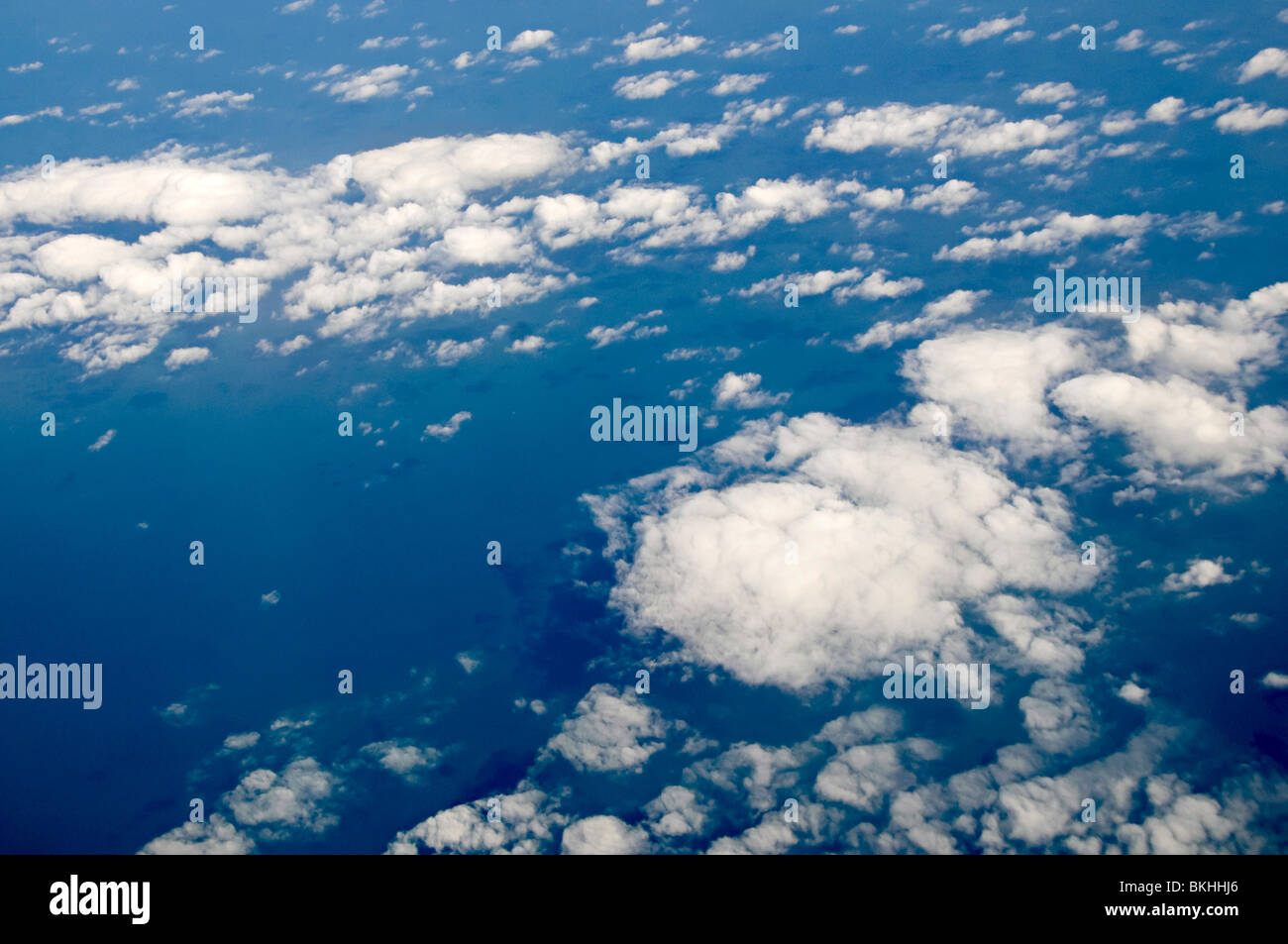 the sky and earth from above taken from an airplane window Stock Photo ...