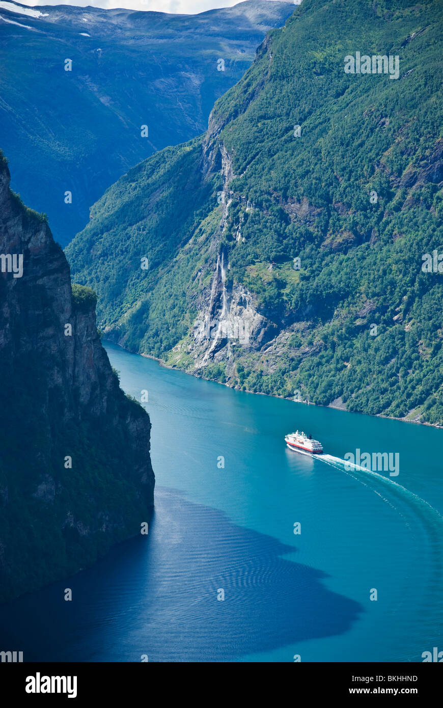 Hurtigruten coastal ferry travels through Geirangerfjord, Norway Stock ...