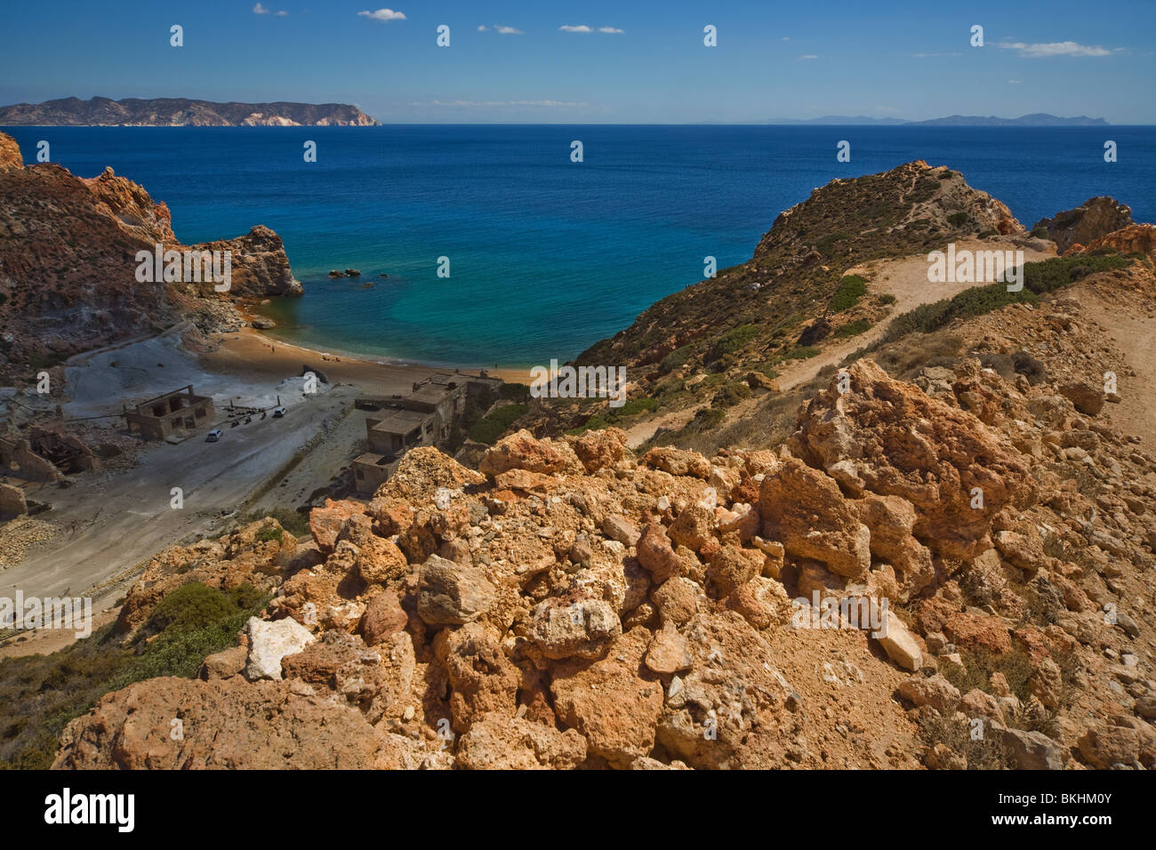 Coast line view with rocks, ruins, deep blue sea in Milos Island ...