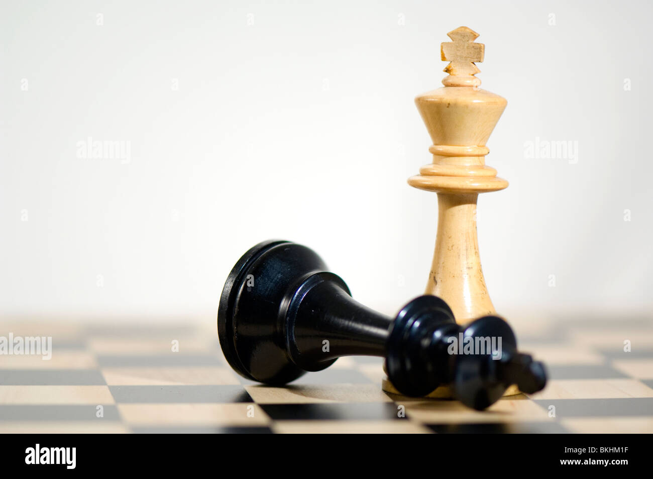 Chess. White King victorious on chess board Stock Photo - Alamy