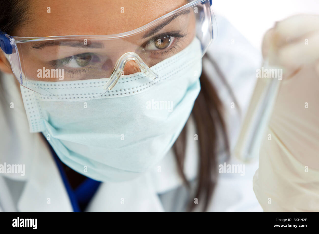A female medical or scientific researcher or woman doctor looking at a ...