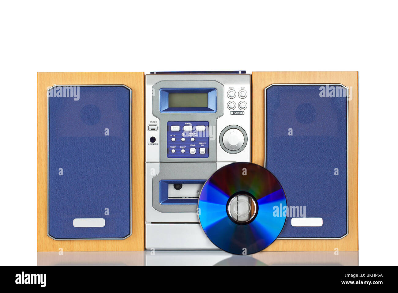 Compact sound system stereo with CD, tape and tuner reflected on white ...