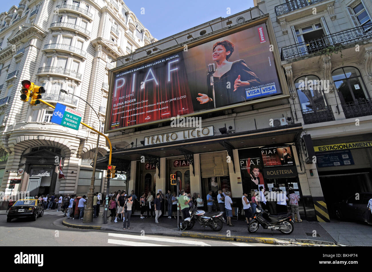 People queeing in front of a theatre to see a play called 'Edith Piaf ...