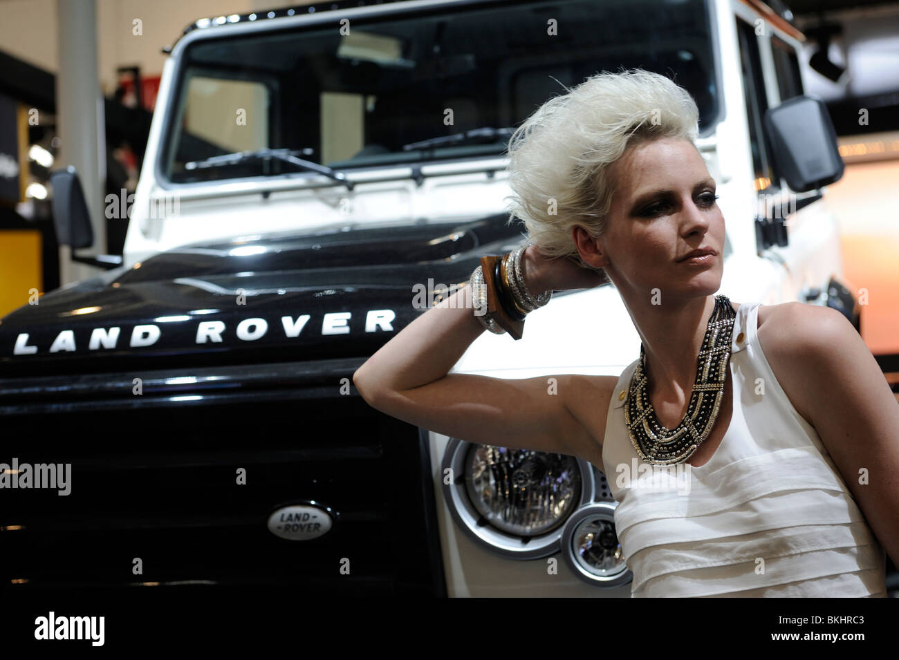 A model poses deside a Land Rover SUV at the Beijing Auto Show 2010 ...
