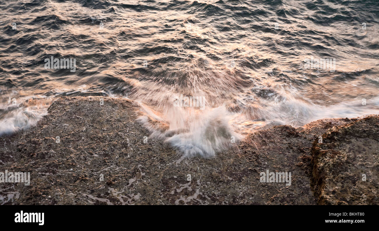 Waves on limestone ledges Portland Bill. Isle of Portland Dorset UK ...