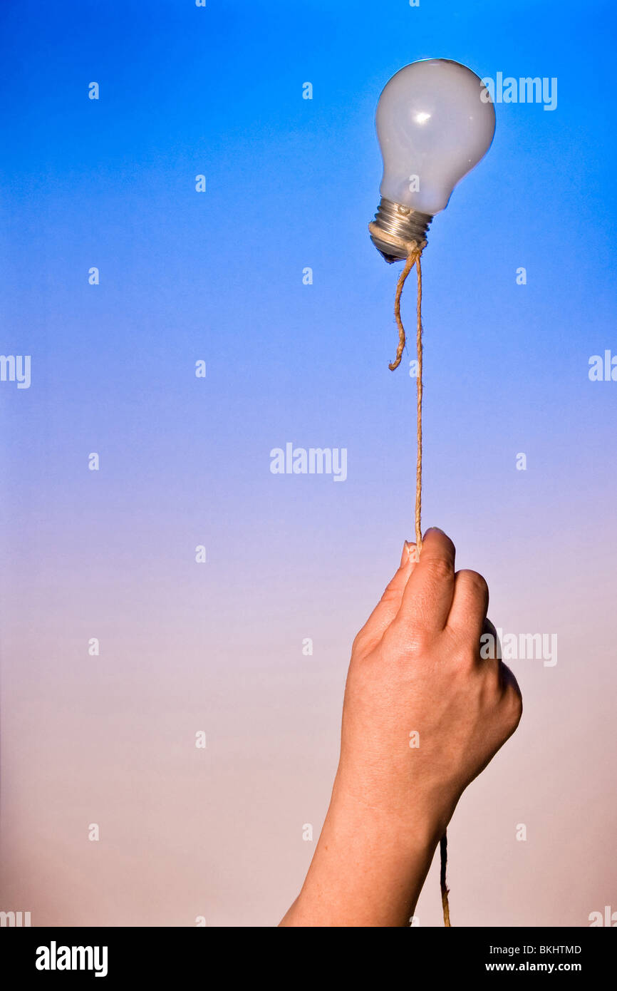A light bulb floating attached by a rope Stock Photo - Alamy