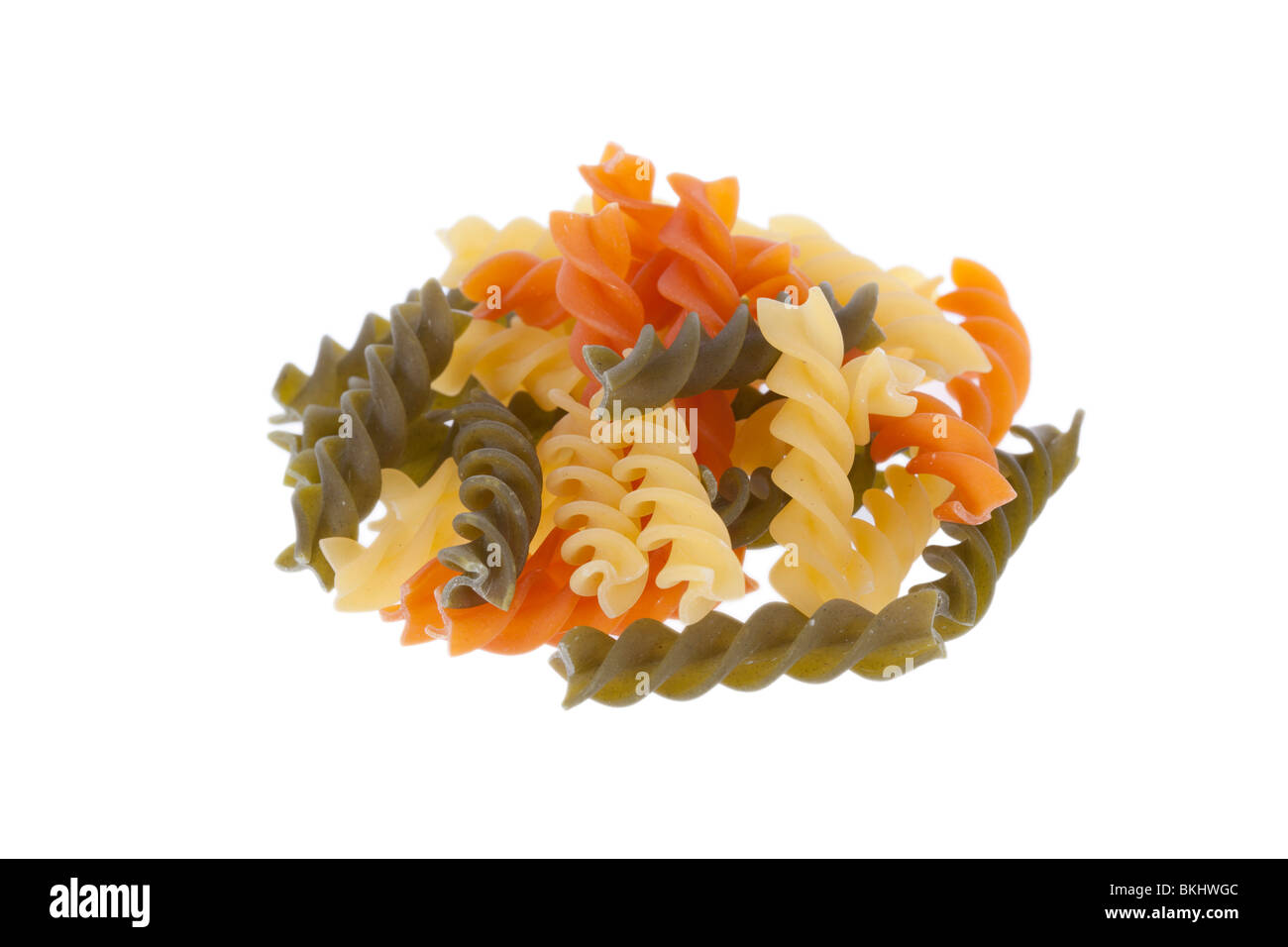 Tricolore fusilli pasta isolated on a white background Stock Photo - Alamy