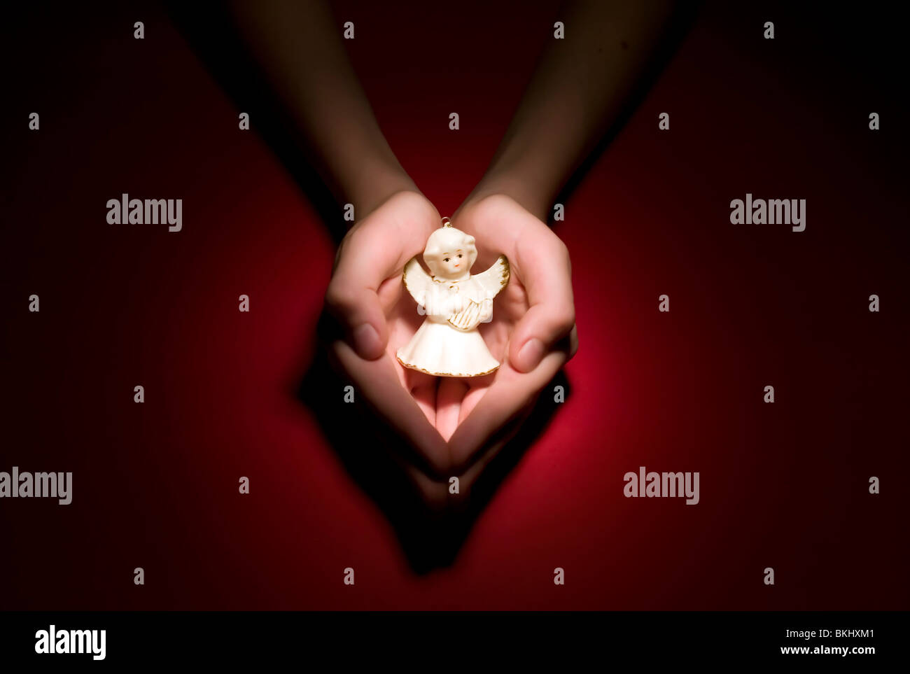 Child is holding figure in his hands Stock Photo - Alamy