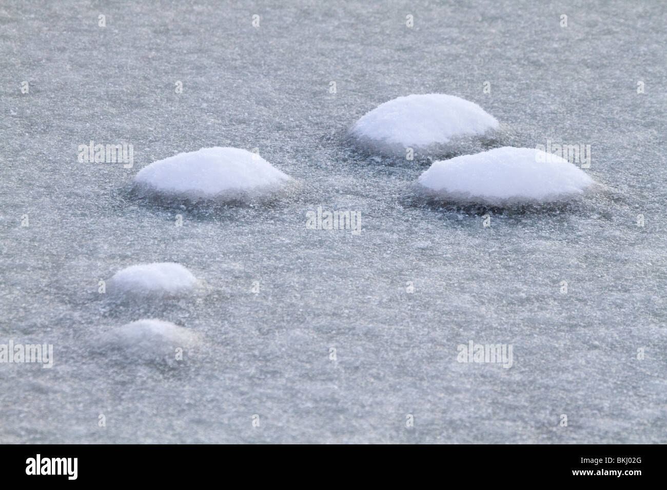 Snow patterns on the ground; winter Stock Photo - Alamy