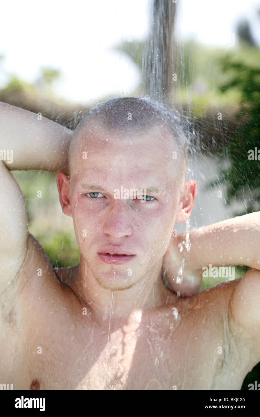 Man taking a shower Stock Photo - Alamy