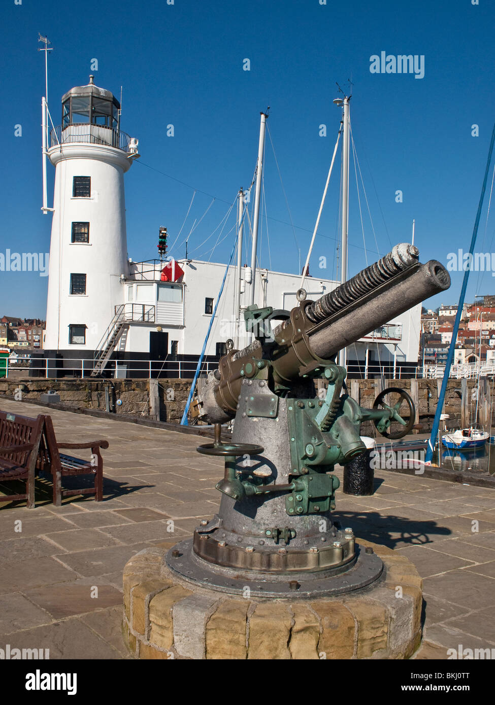 Lighthouse and WW1 ships gun Scarborough Yorkshire UK Stock Photo - Alamy