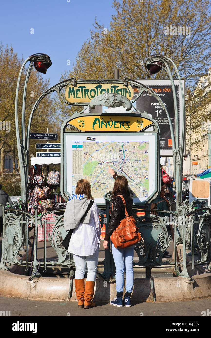 Finding directions in Anvers metro station, Paris Stock Photo - Alamy