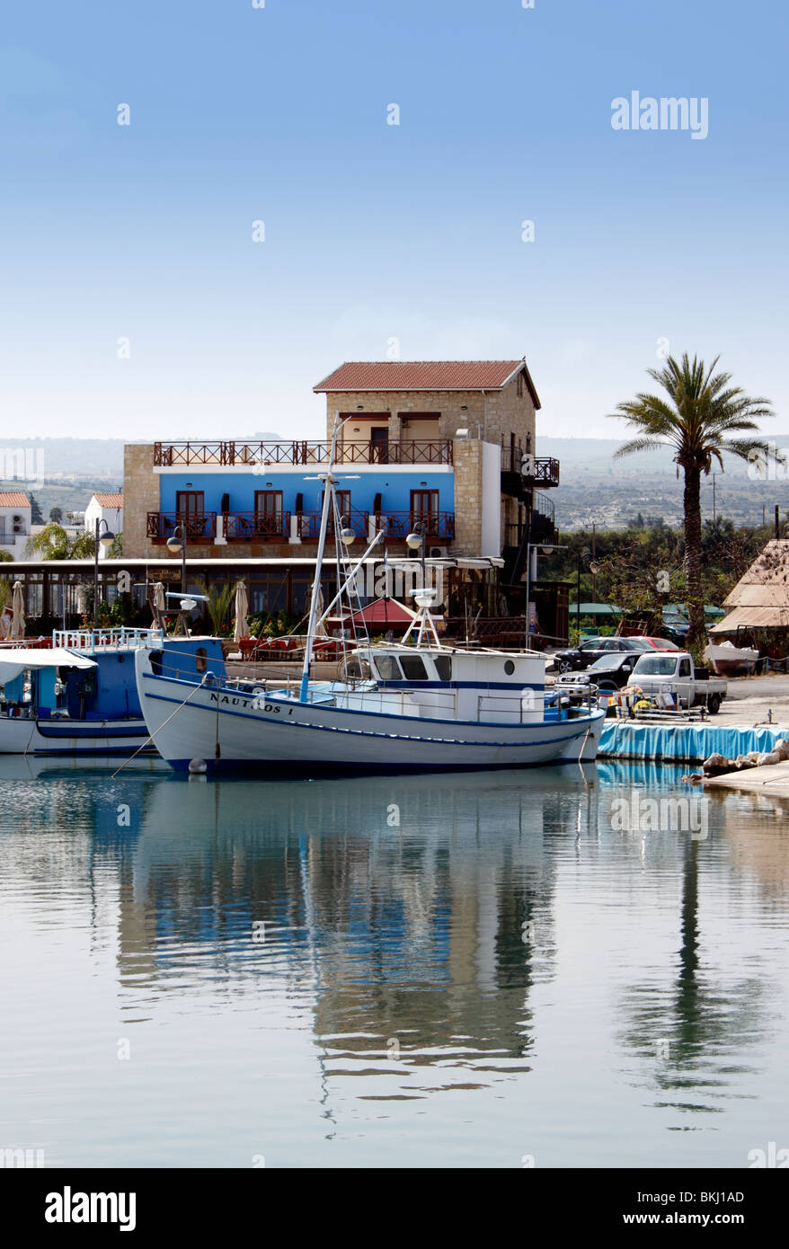 FISHING BOATS AT REST IN THE PICTURESQUE HARBOUR AT LATCHI ON THE ...