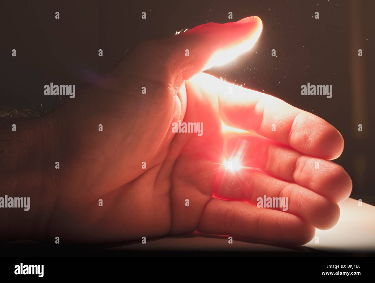 Light Shining Onto A Hand Stock Photo - Alamy