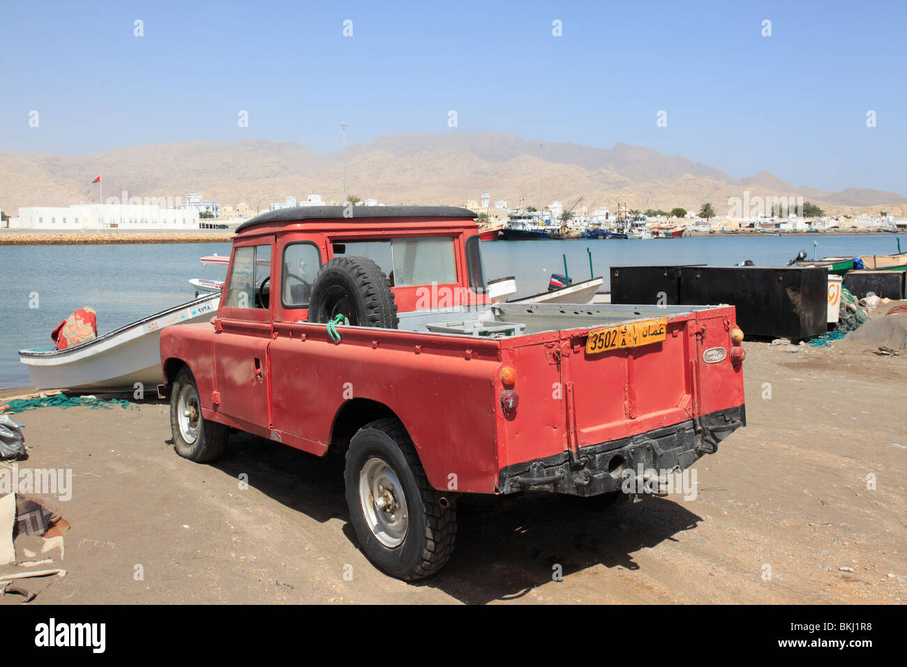 old offroad vehicle at the beach and port of Fishing Village of Quriyat ...